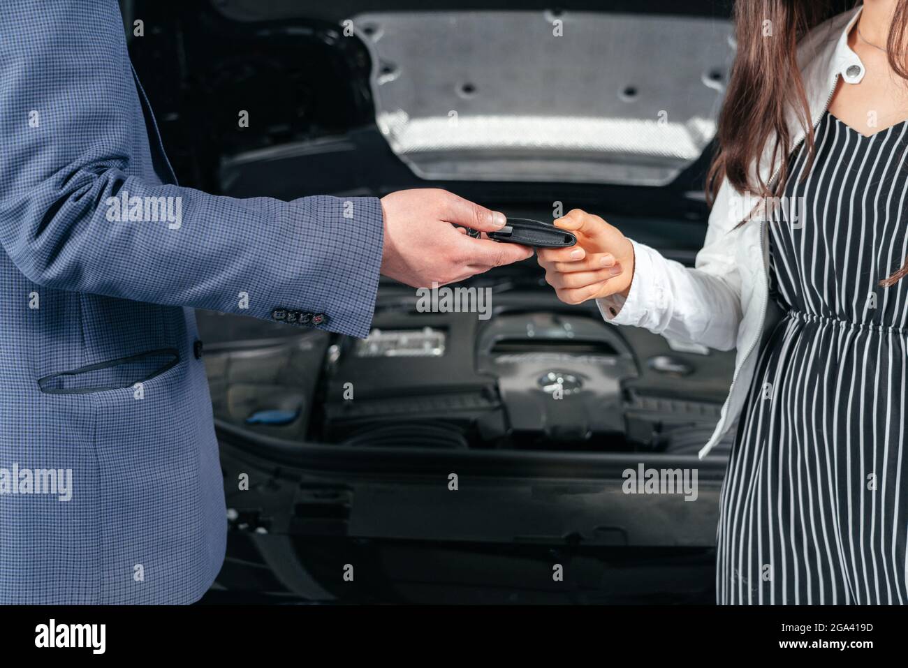 Mechanic giving car key man hi-res stock photography and images - Alamy