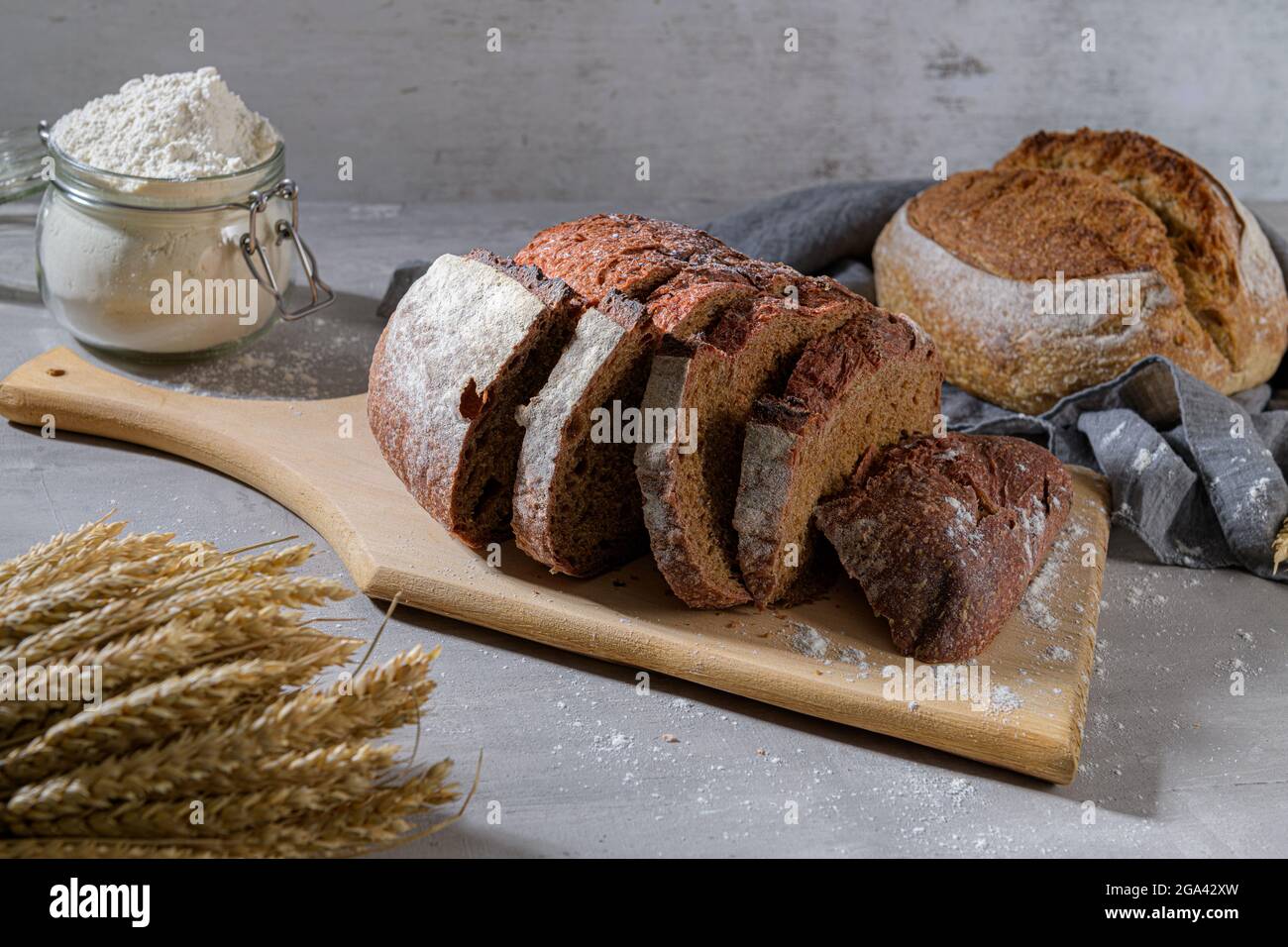 Slices of homemade beetroot bread, and crispy wheat and rye bread. On a ...
