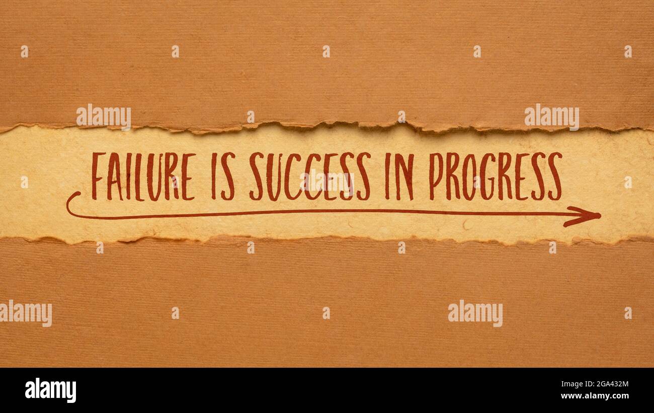 Failure is success in progress - inspirational handwriting on a handmade paper, business ...
