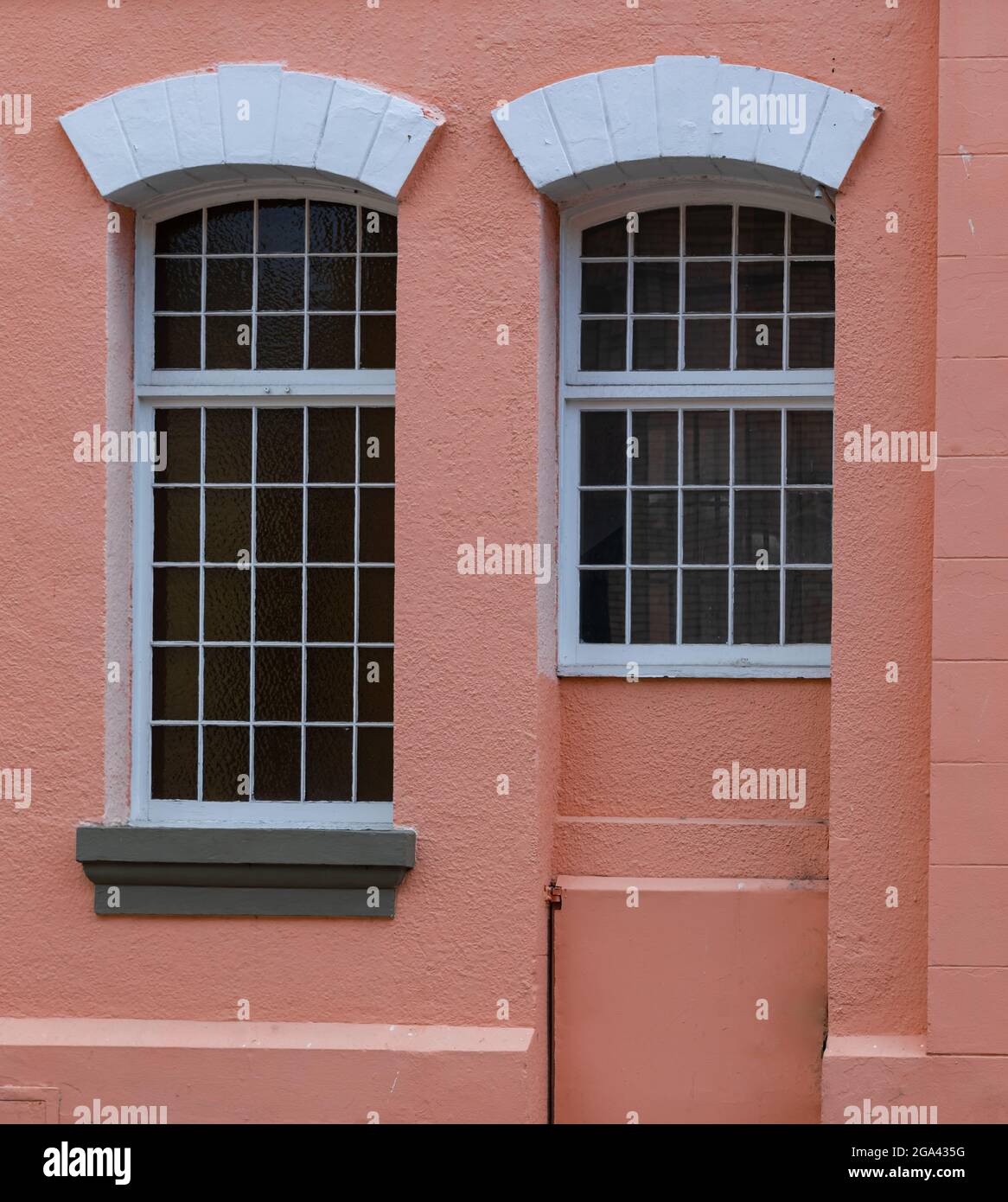 vintage metal windows on colorful wall of the house in old city ...