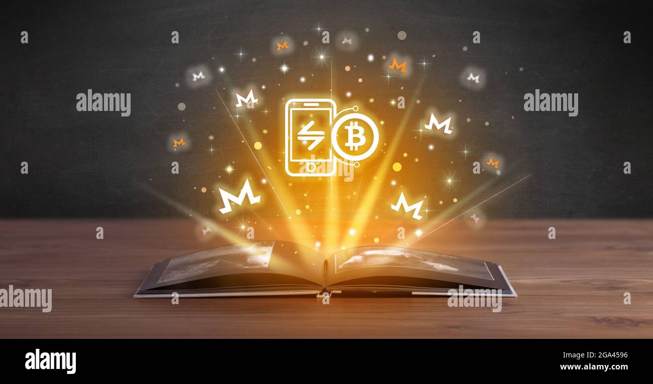 Open book with currency icons above Stock Photo - Alamy