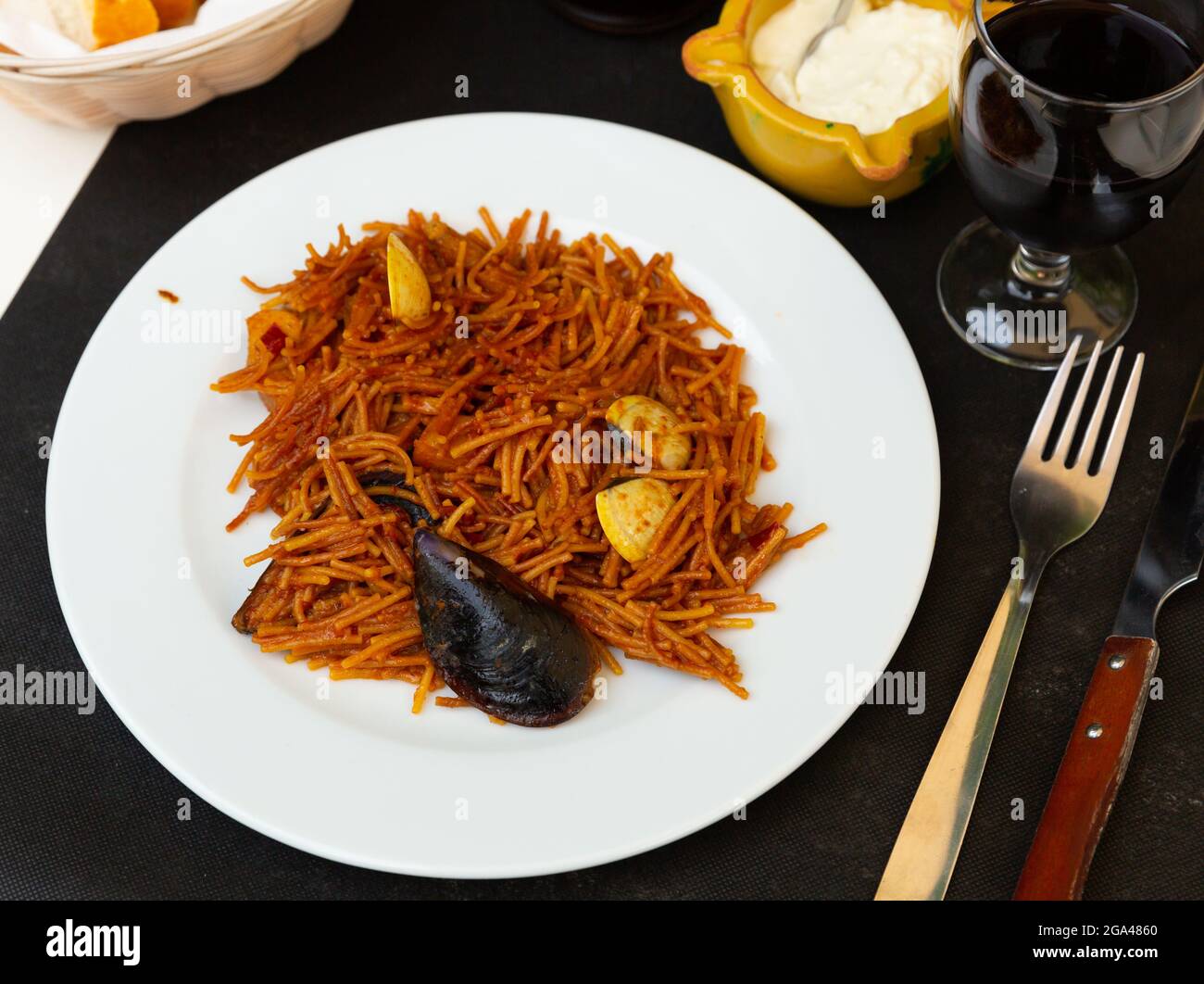 Paella with fideua, pasta noodles and seafood Stock Photo - Alamy