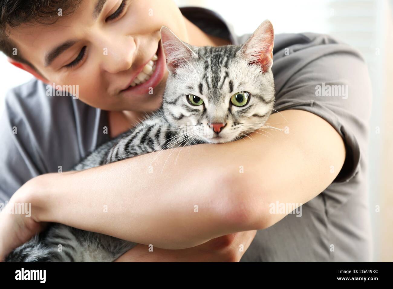 Male model holding cat High Resolution Stock Photography and Images - Alamy