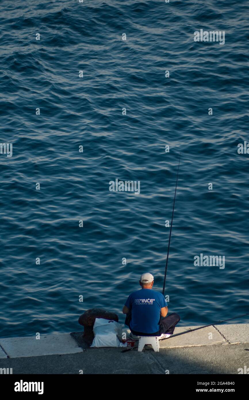Fisherman spinning fishing reel sitting hi-res stock photography and ...