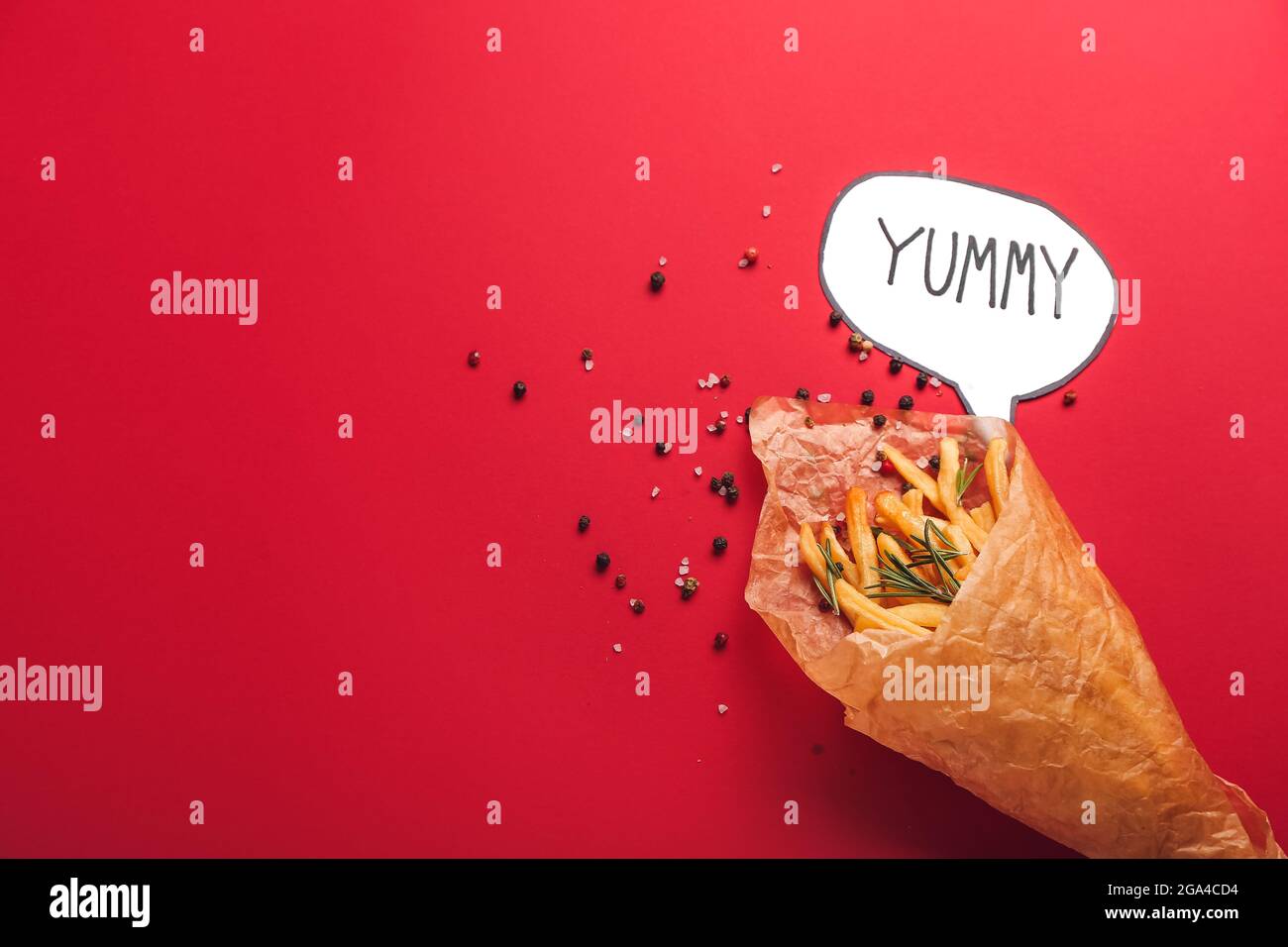 Word YUMMY and tasty french fries on color background Stock Photo - Alamy