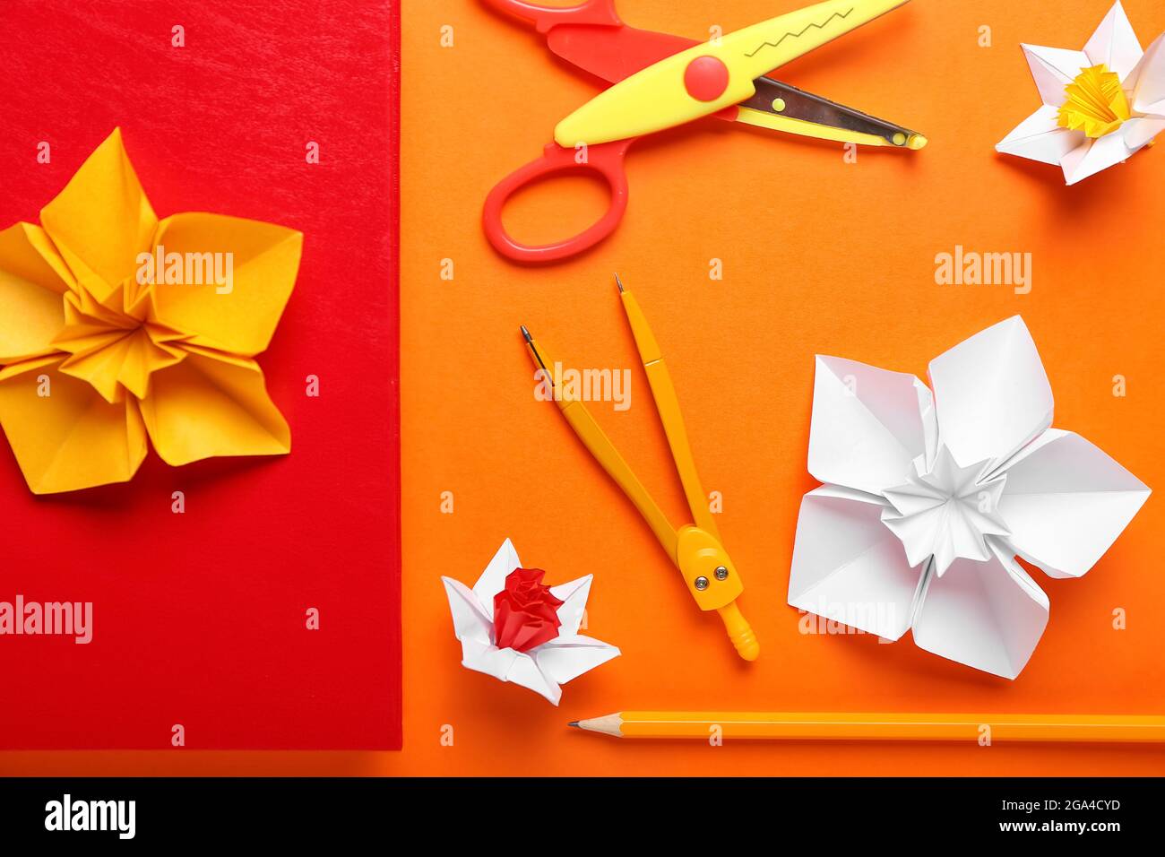 Origami daffodils and stationery on color background Stock Photo - Alamy