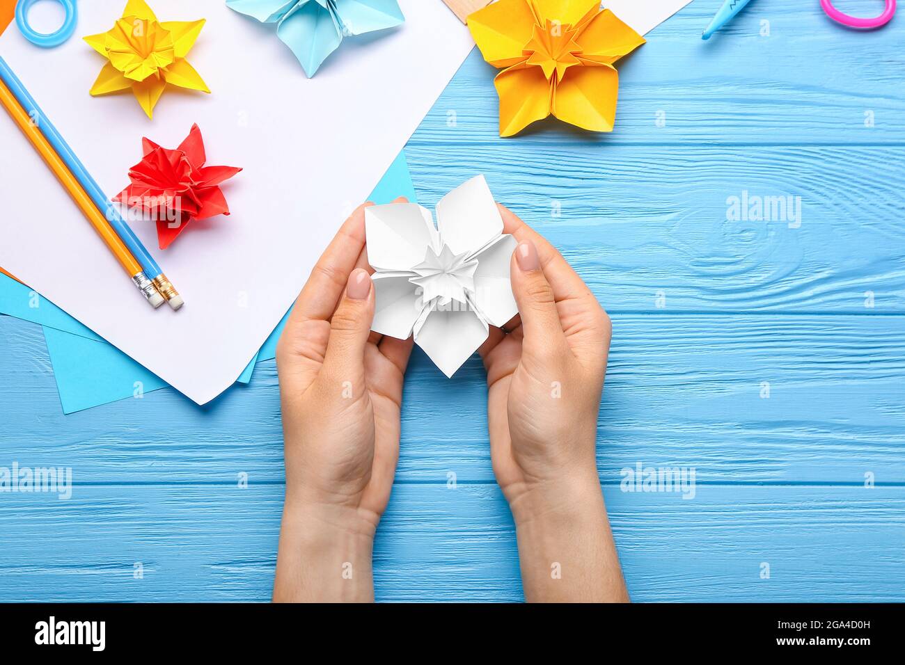 Hands making origami top view hi-res stock photography and images - Alamy