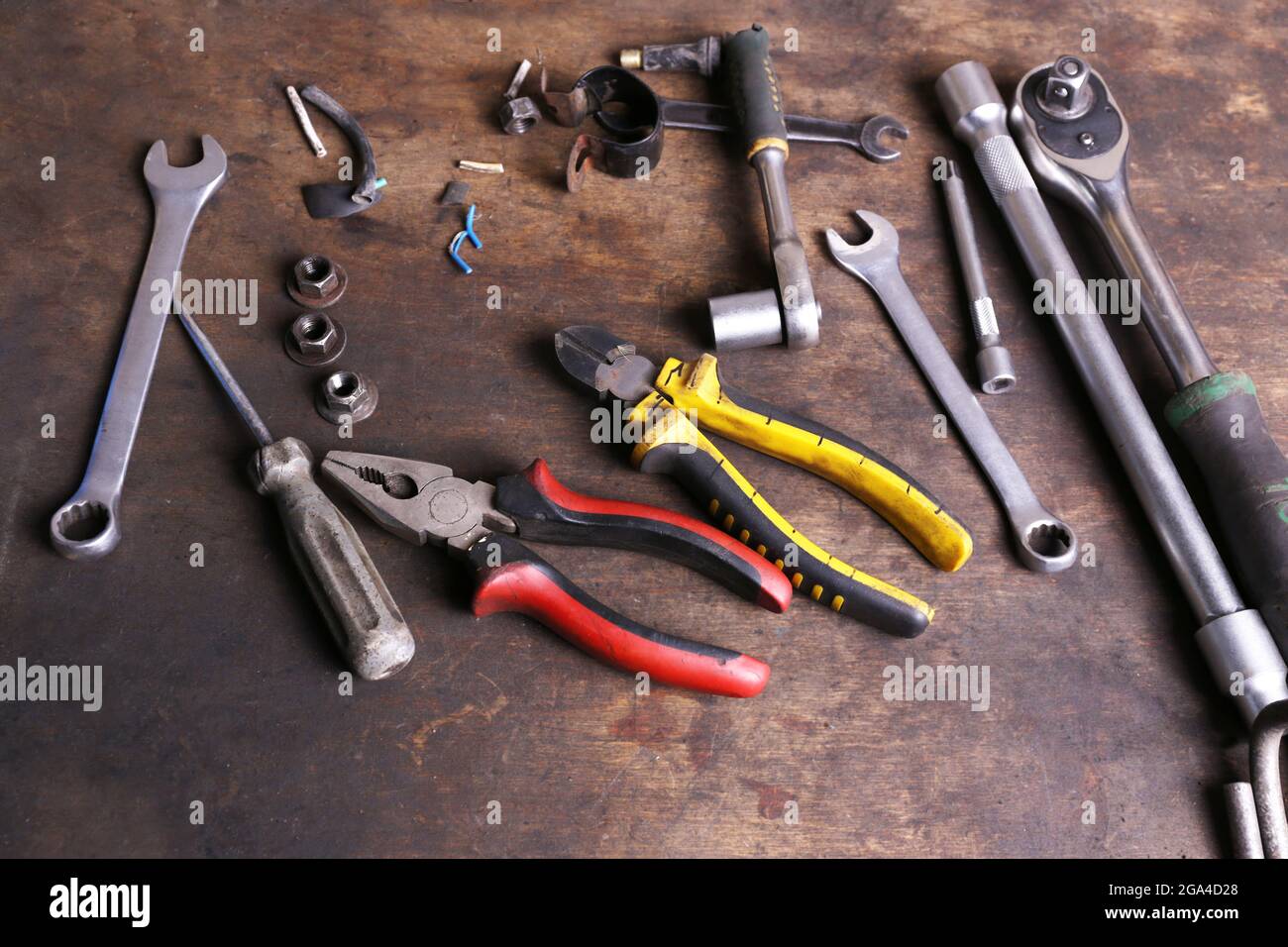 Different tools on workplace in garage Stock Photo - Alamy