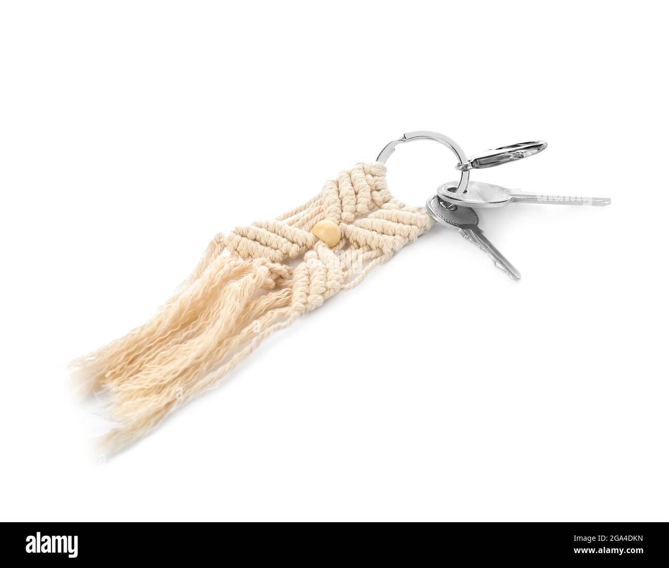 Keys with handmade cotton keychain on white background Stock Photo - Alamy