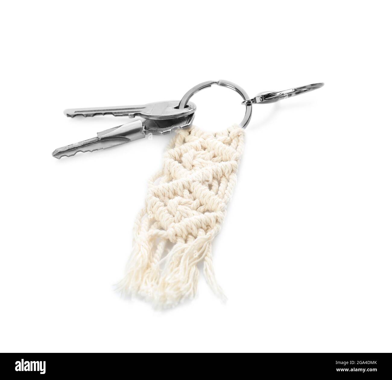 Keys with handmade cotton keychain on white background Stock Photo - Alamy