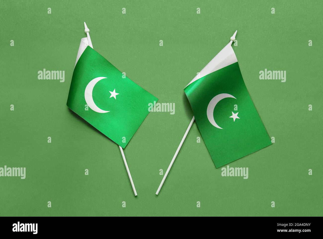 Pakistan flags on color background Stock Photo - Alamy