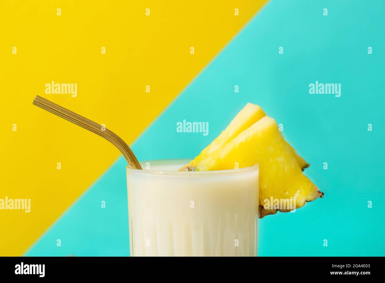 Glass with tasty Pina Colada cocktail on color background Stock Photo ...