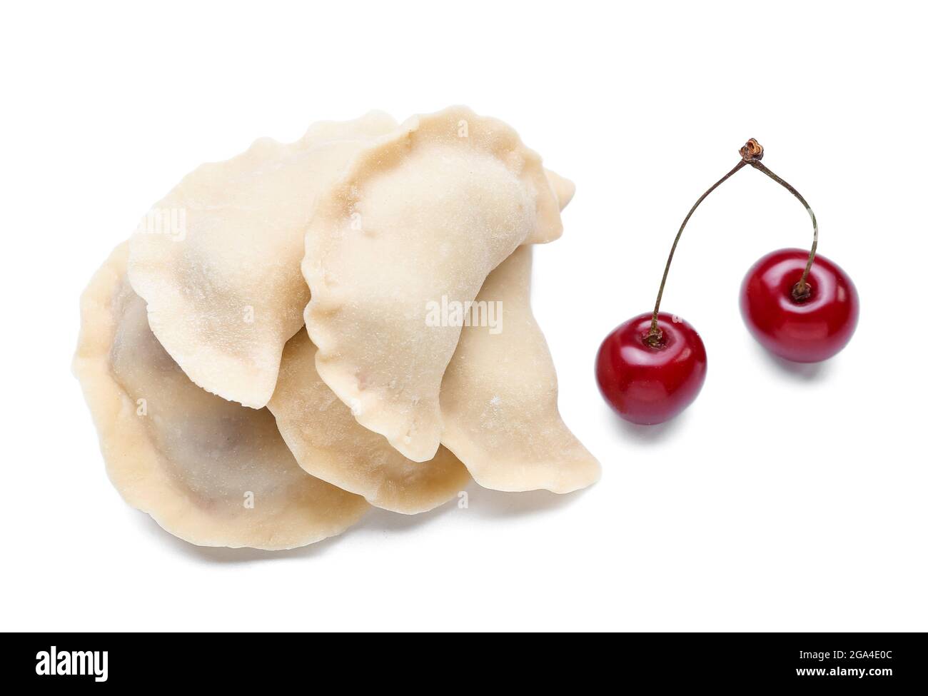 Raw cherry dumplings on white background Stock Photo - Alamy