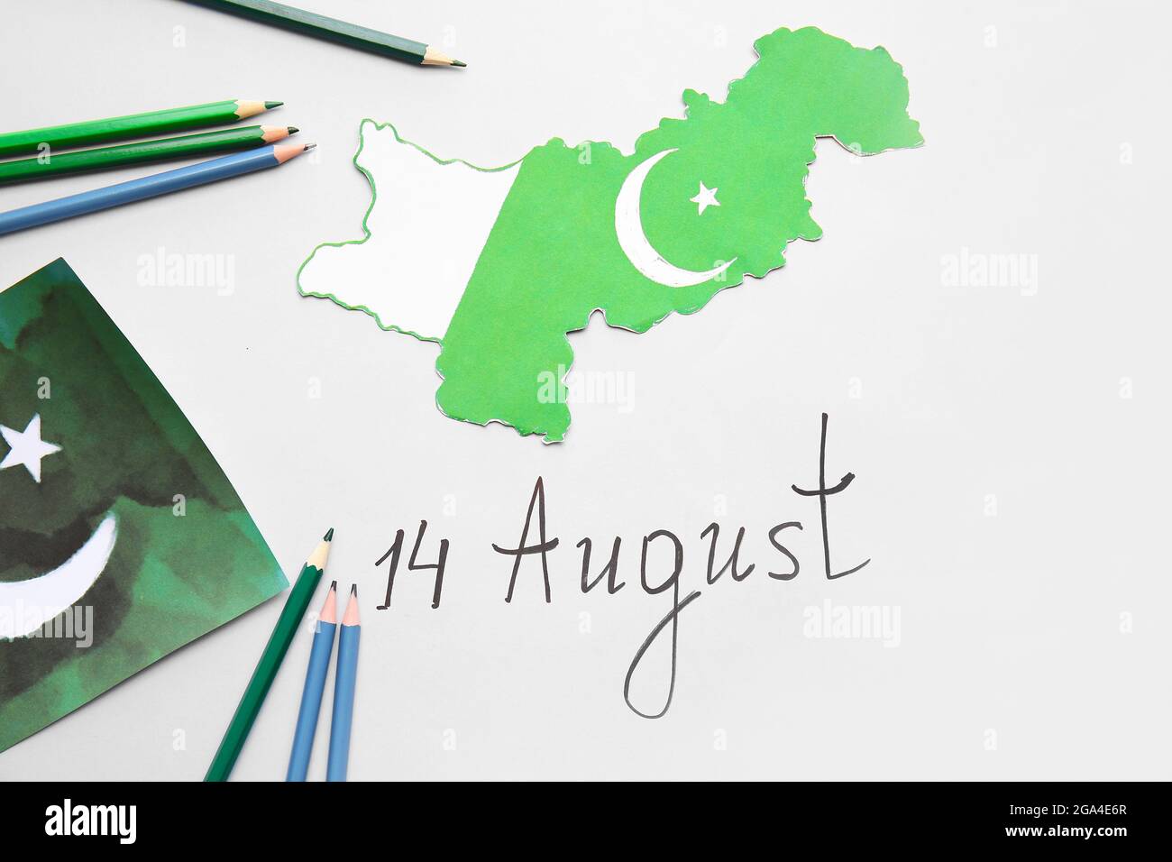 Map and flag of Pakistan with pencils and date of Independence Day on ...