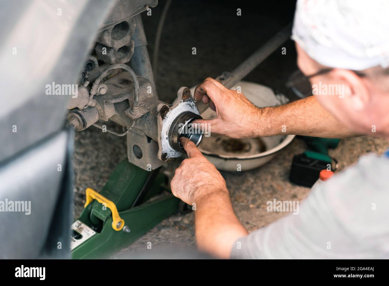 Auto mechanic repairing the brake system of car Stock Photo - Alamy