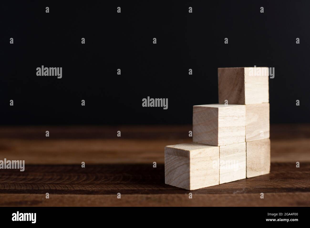 Mock up Stacked wooden cube on a table. Concept of improvement Stock ...