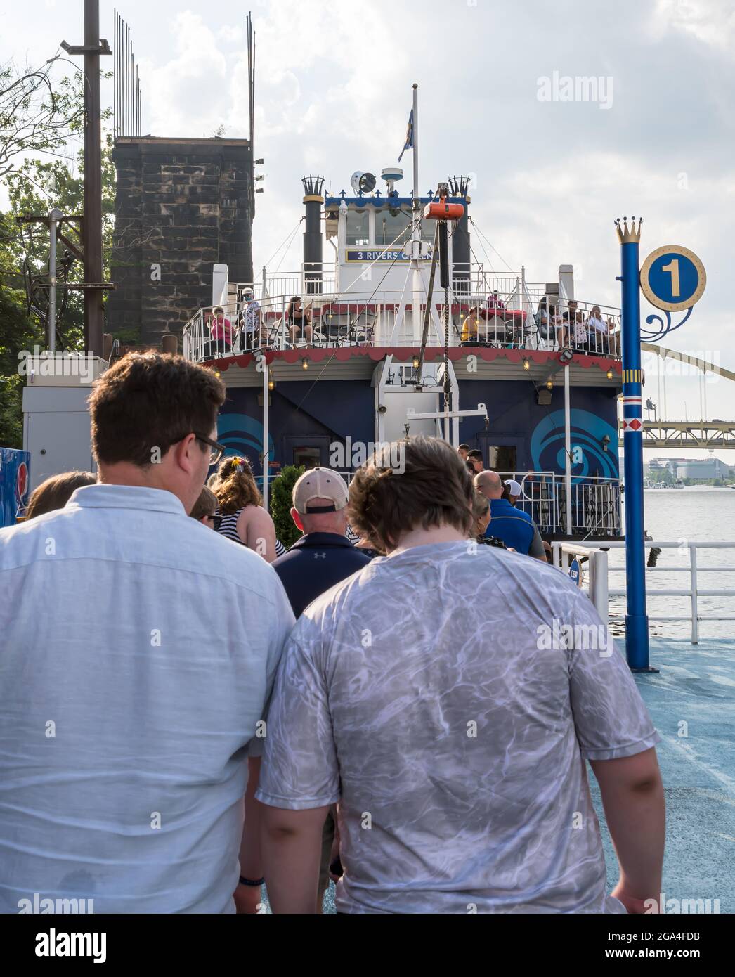 People boarding the 3 Rivers Queen, a paddle boat in the Gateway ...