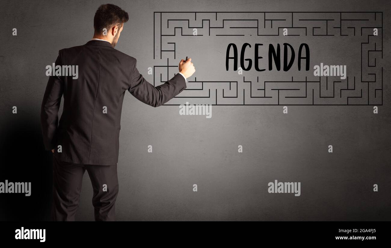 businessman drawing maze Stock Photo - Alamy