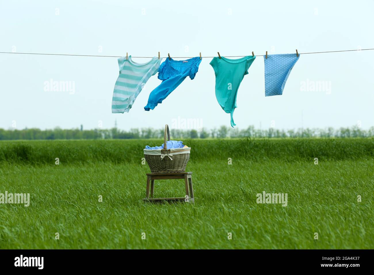 Laundry line with clothes in field Stock Photo - Alamy