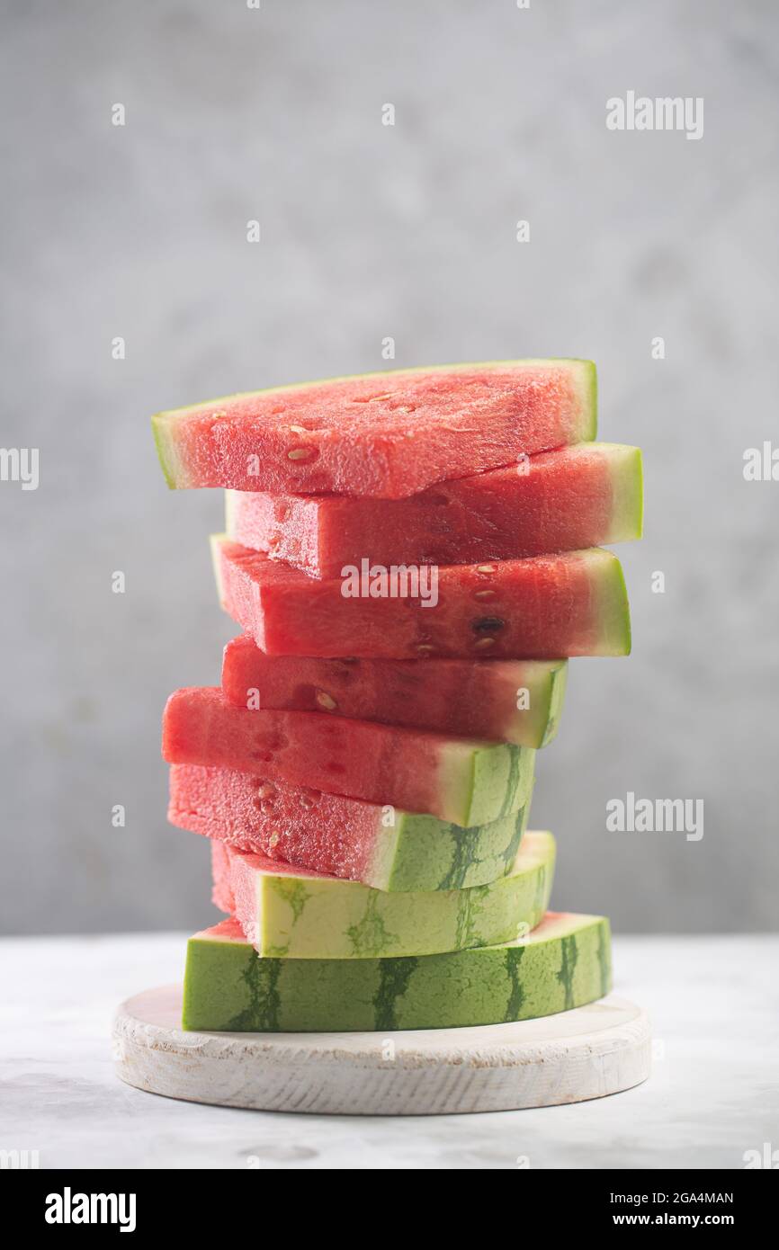 Stack of watermelon chunks on gray background. It sweet, juicy flesh ...