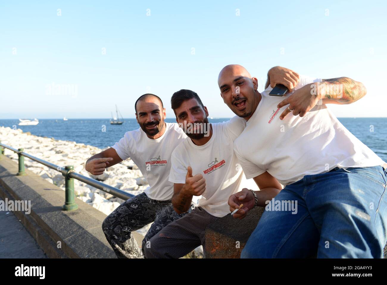 Italian guys posing for a pic on the seafront promenade in Naples ...