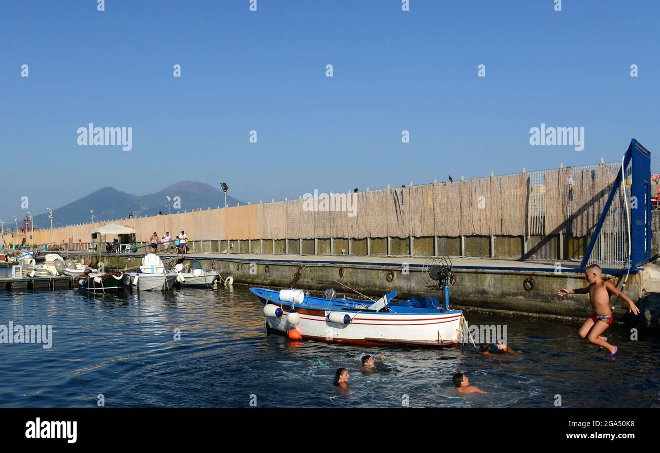 Italian children jumping into the water at the Porticciolo Molosiglio ...