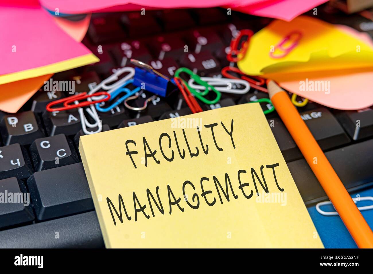 Hand writing sign Facility Management. Concept meaning maintenance of ...