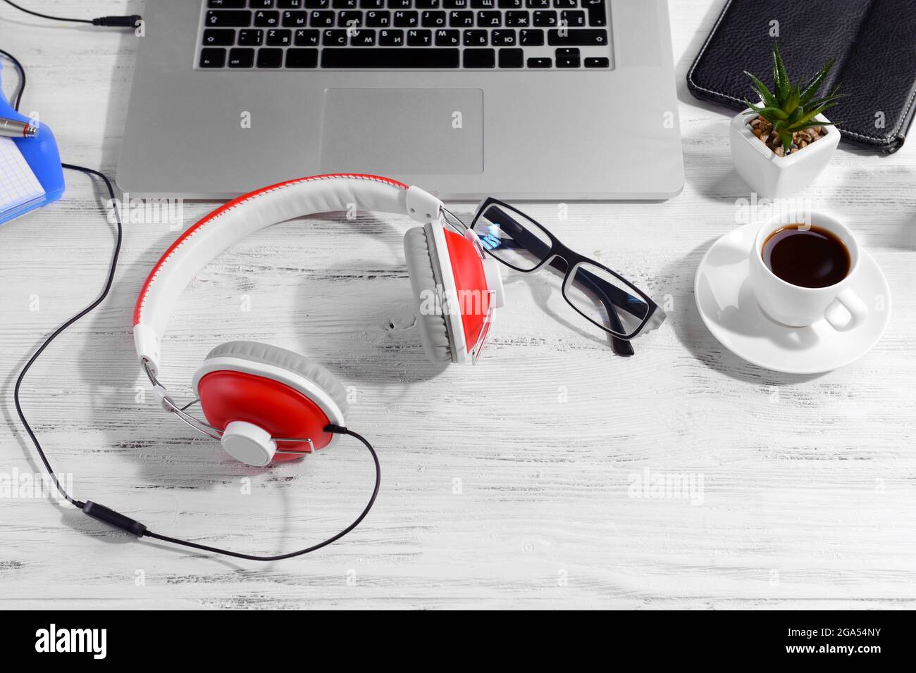Workplace with headphones on table close up Stock Photo - Alamy