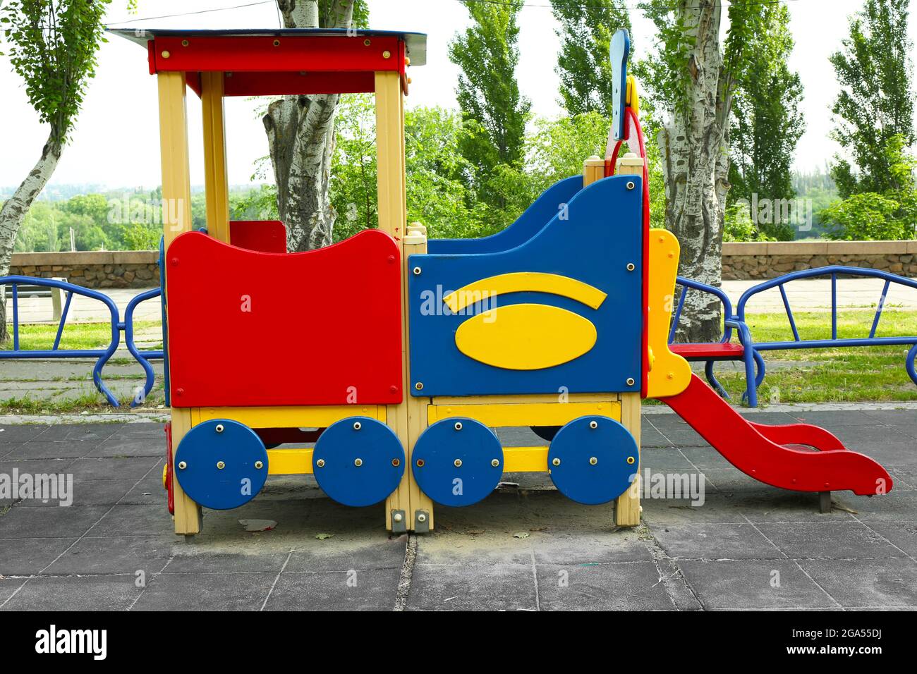 Colorful slide on playground in public park Stock Photo - Alamy