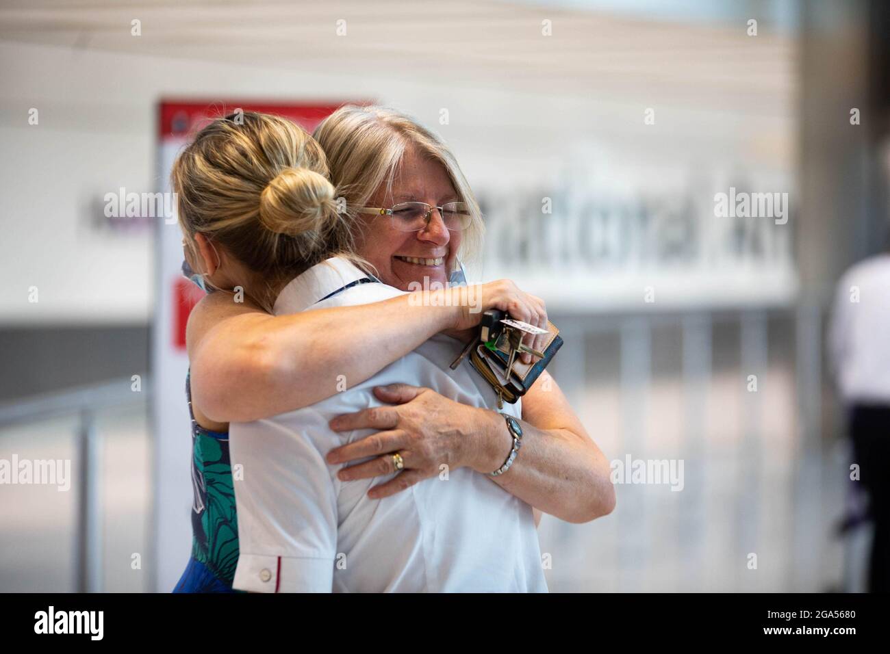 EDITORIAL USE ONLY Passengers reunite with family and friends at ...
