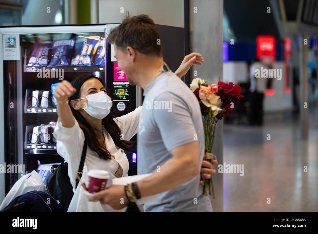 EDITORIAL USE ONLY Passengers reunite with family and friends at ...