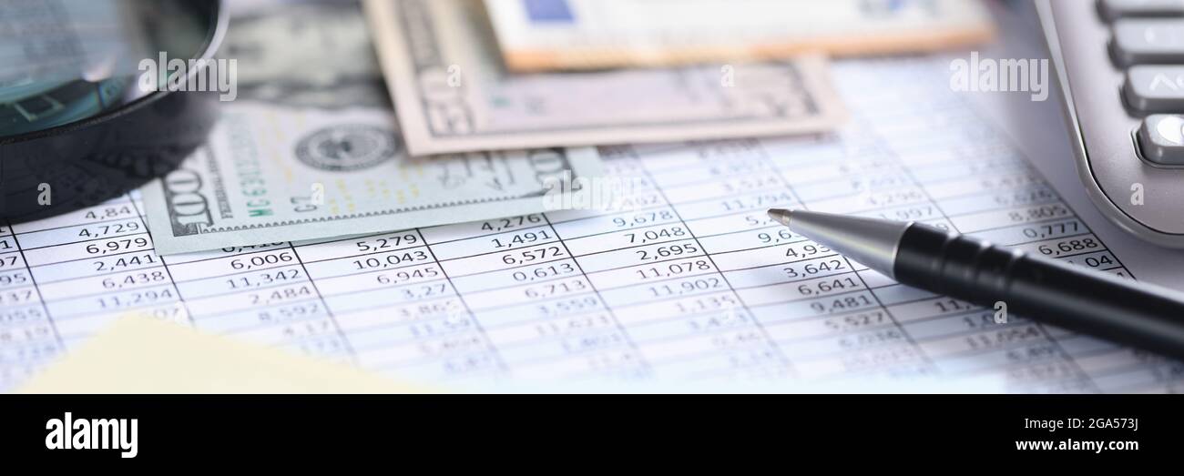 Money and calculator lying on table with numbers closeup Stock Photo ...
