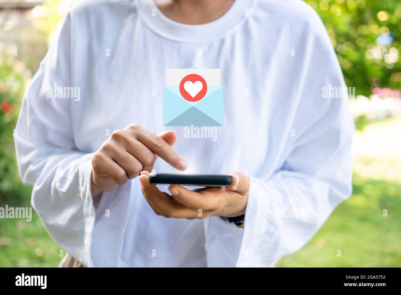 Woman hand using smartphone and it's show email recieve notification ...