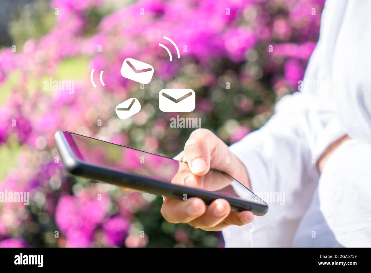Woman hand using smartphone and it's show email recieve notification ...