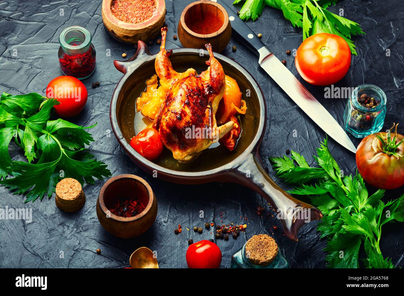 Whole quails roasted in tomato sauce. Fried quails meat Stock Photo - Alamy