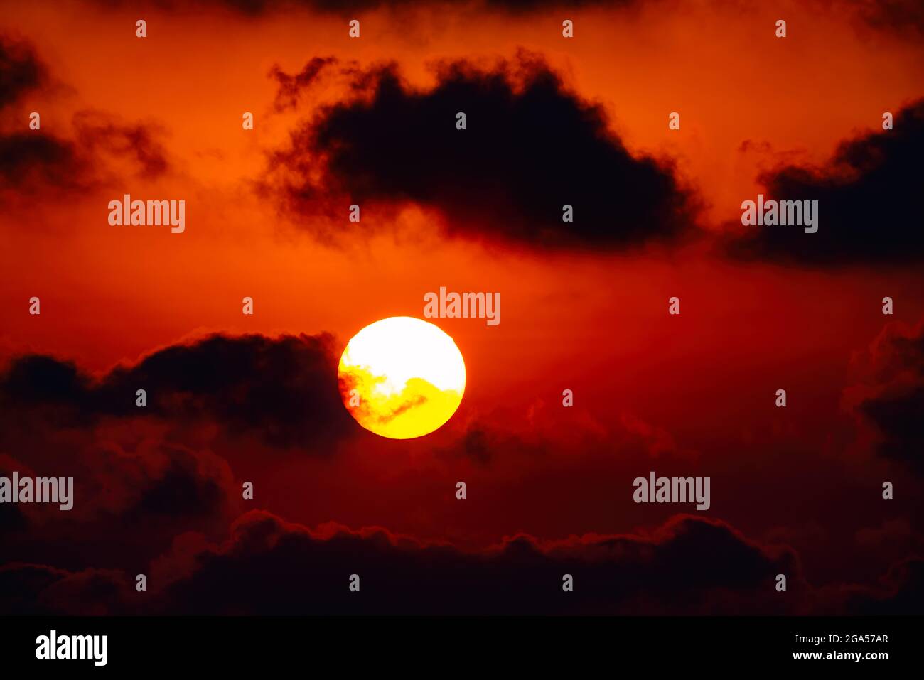 Colorful sun in the clouds background Stock Photo - Alamy