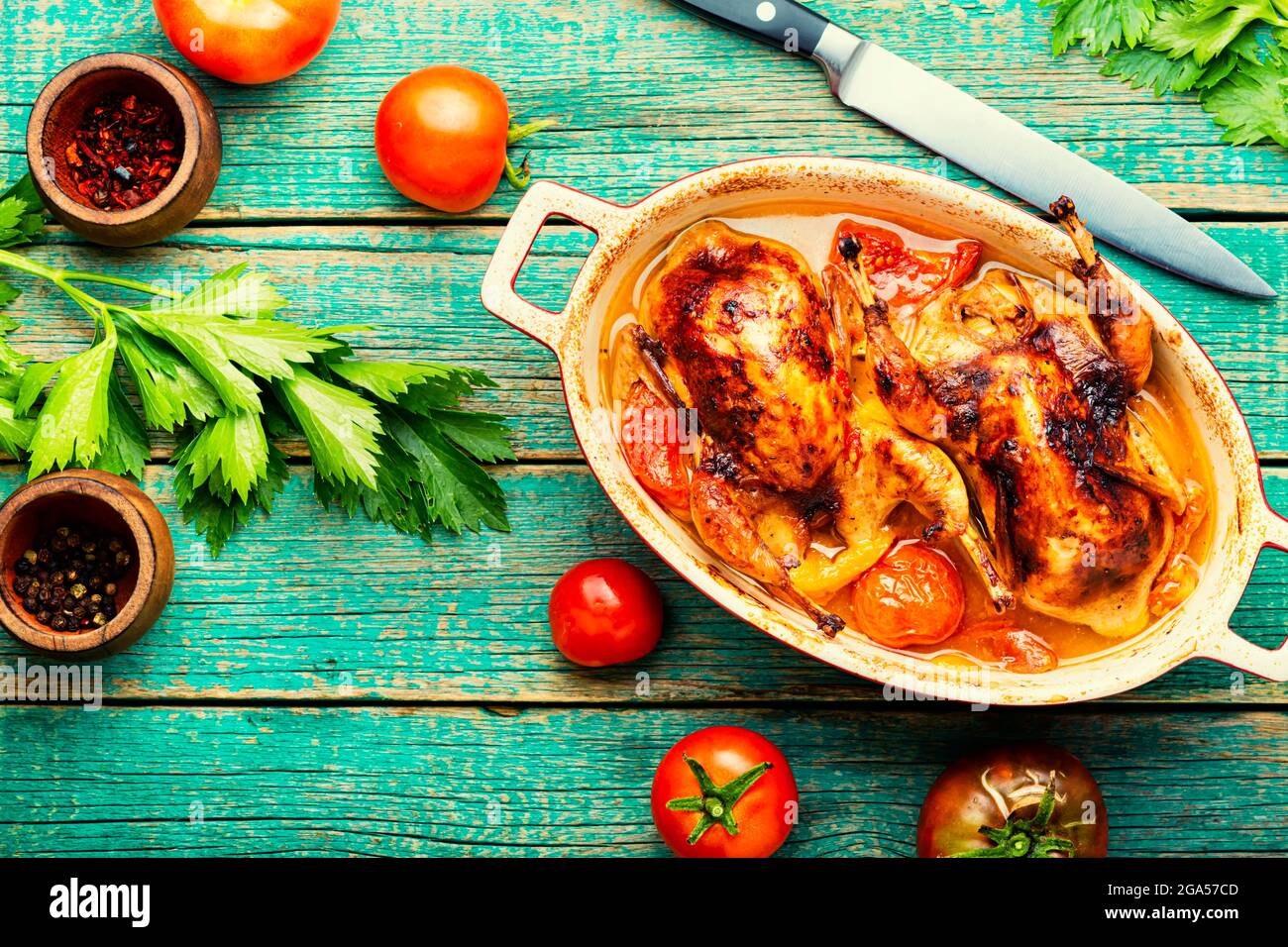 Whole quails roasted in tomato sauce. Fried quails meat Stock Photo - Alamy
