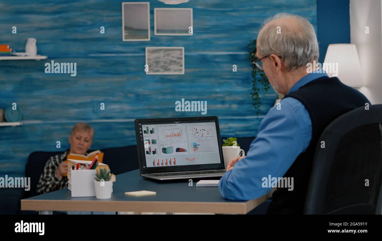 Middle aged senior older man e-learning online concept, watching ...