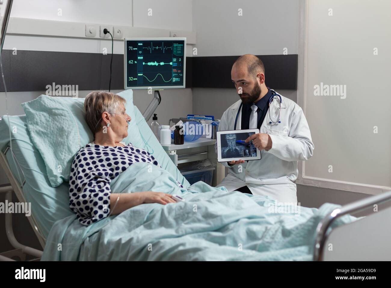 Sick senior woman receiving a medication through an intravenous line ...