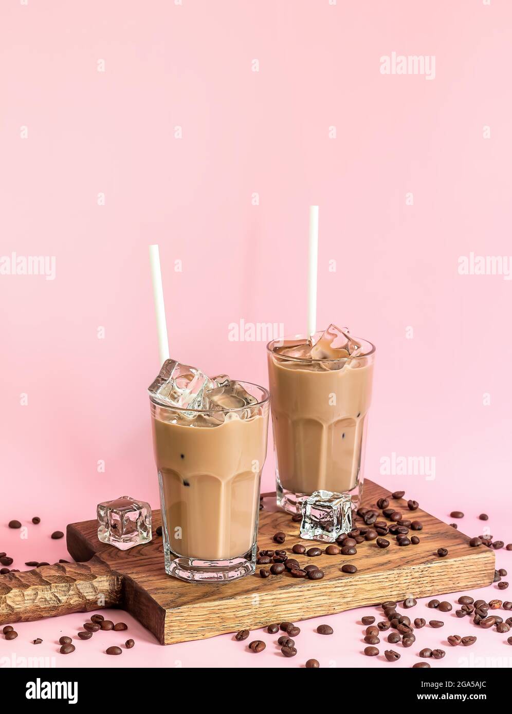 Cold brew coffee with ice cubes and milk Stock Photo - Alamy