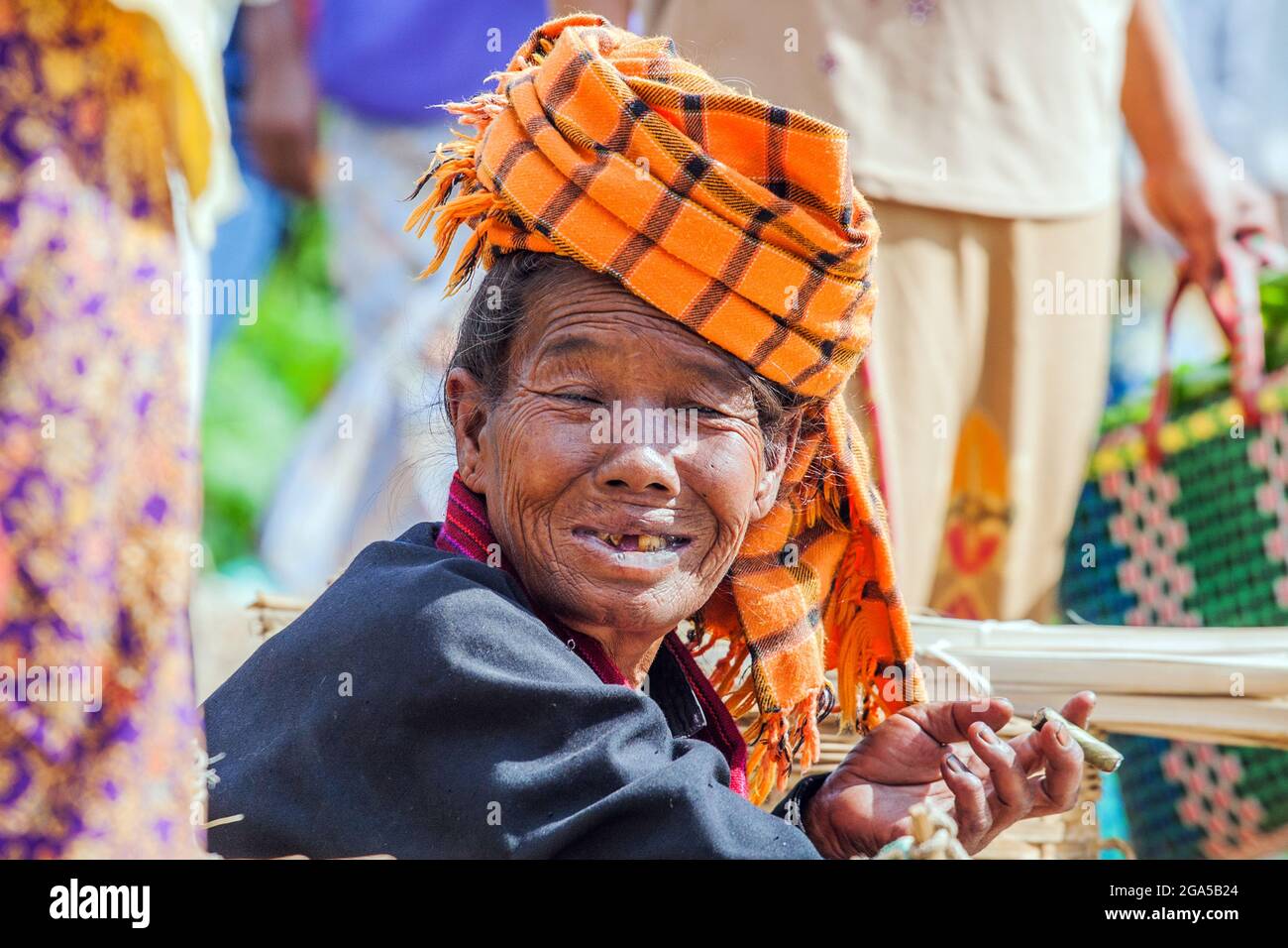 Market trader from Pa'o (Pa-o) ethnic hill tribe wearing orange turban ...