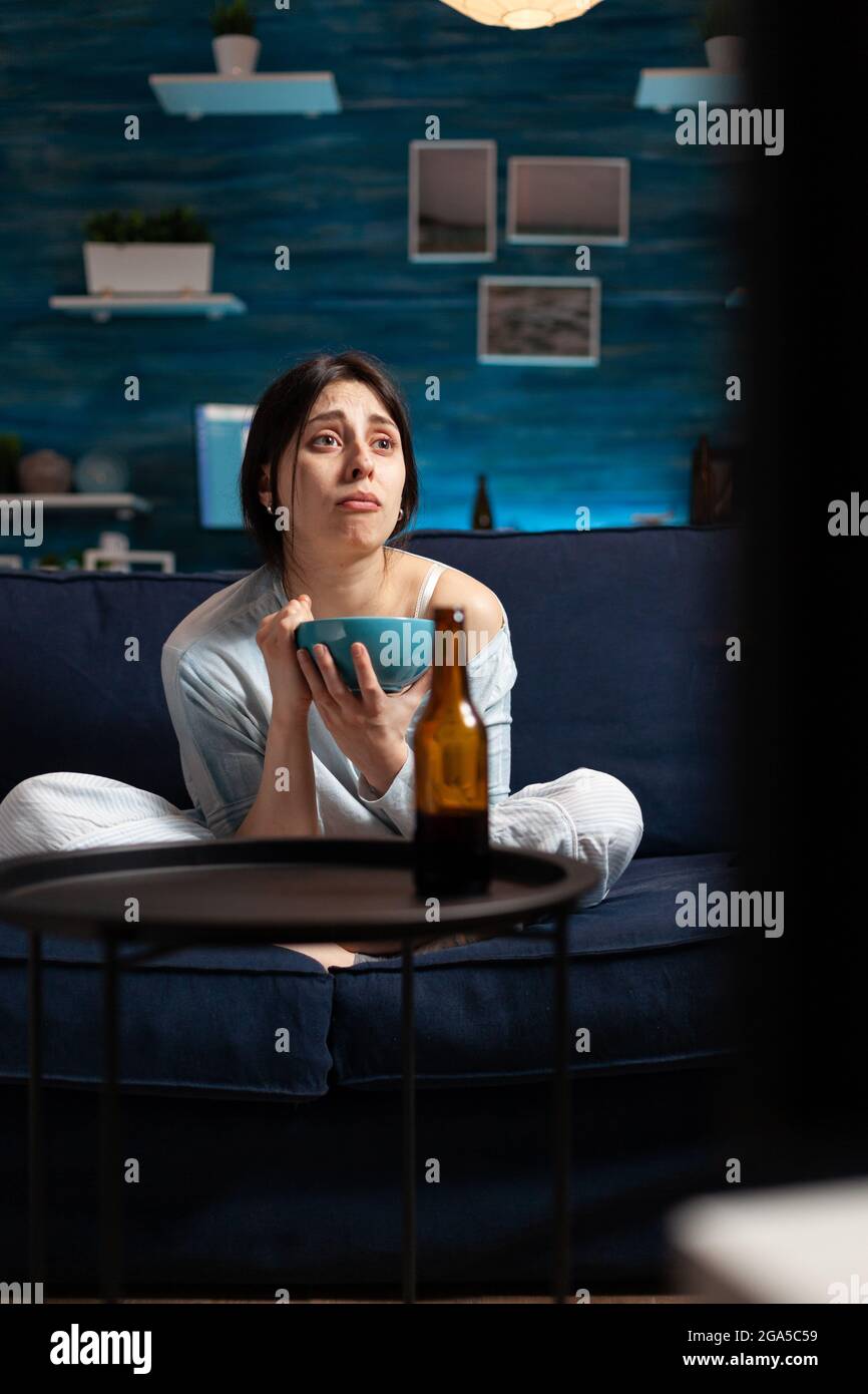 Person watching tv sad hi-res stock photography and images - Alamy