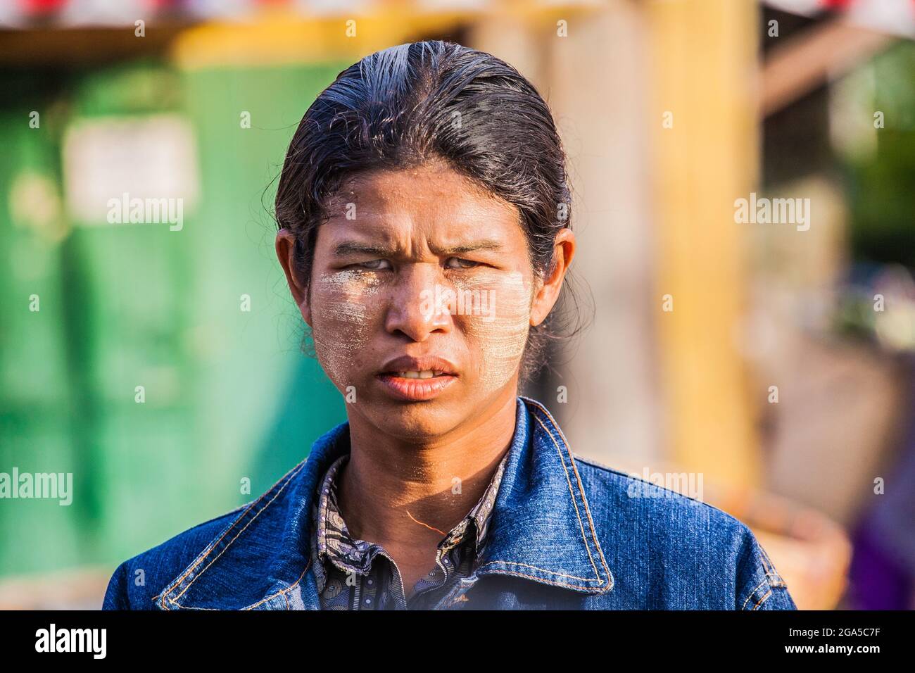 Burmese female wearing denim jacket with thanaka face powder, Kalaw ...