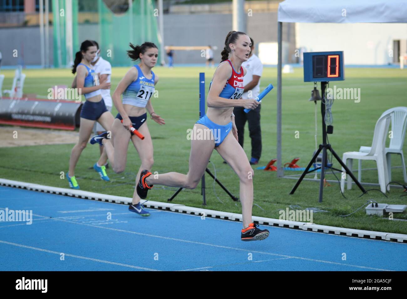 ISTANBUL, TURKEY - JUNE 13, 2021: Athletes running running 4x400 metres ...