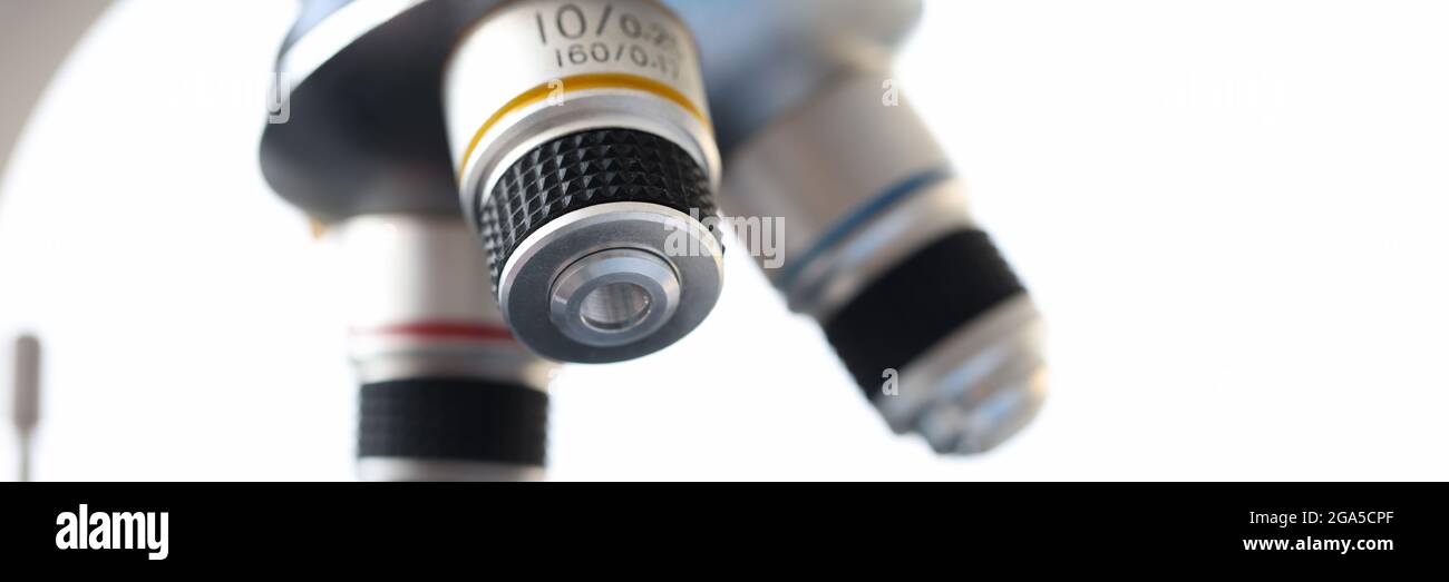 Closeup of head of biological microscope in laboratory Stock Photo - Alamy