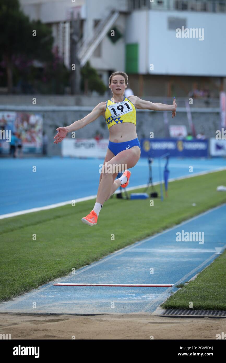 ISTANBUL, TURKEY - JUNE 13, 2021: Undefined athlete long jumping during ...