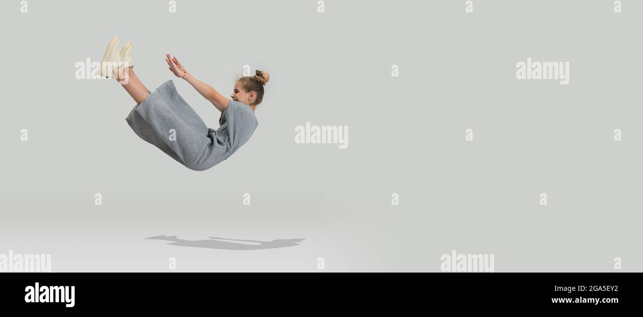 Studio shot of little preschool caucasian girl in casual clothes ...