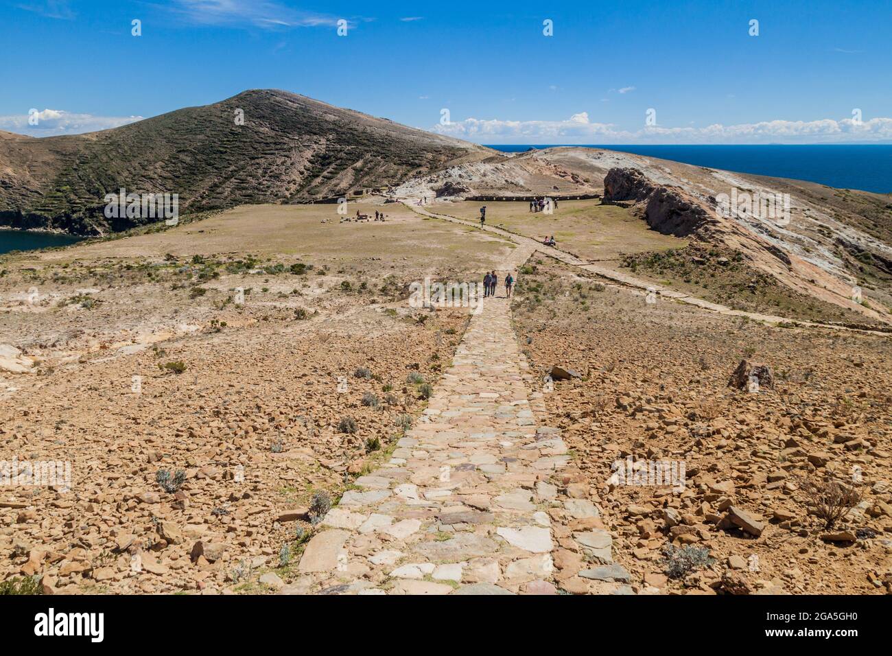 ISLA DEL SOL, BOLIVIA - MAY 12, 2015: Tourists walk on an ancient inca ...