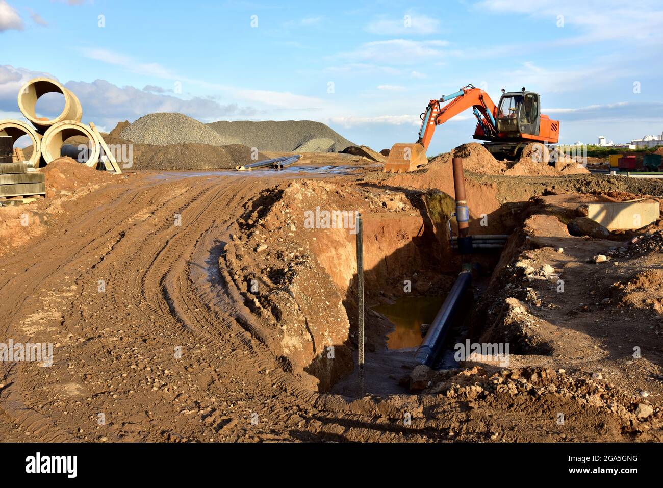 Excavator dig the trenches at a construction site. Trench for laying ...