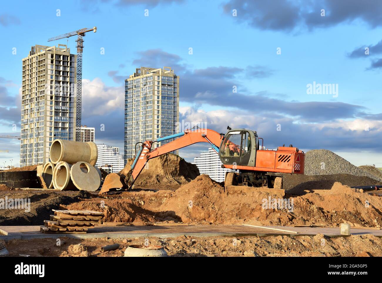 Excavator dig the trenches at a construction site. Trench for laying ...